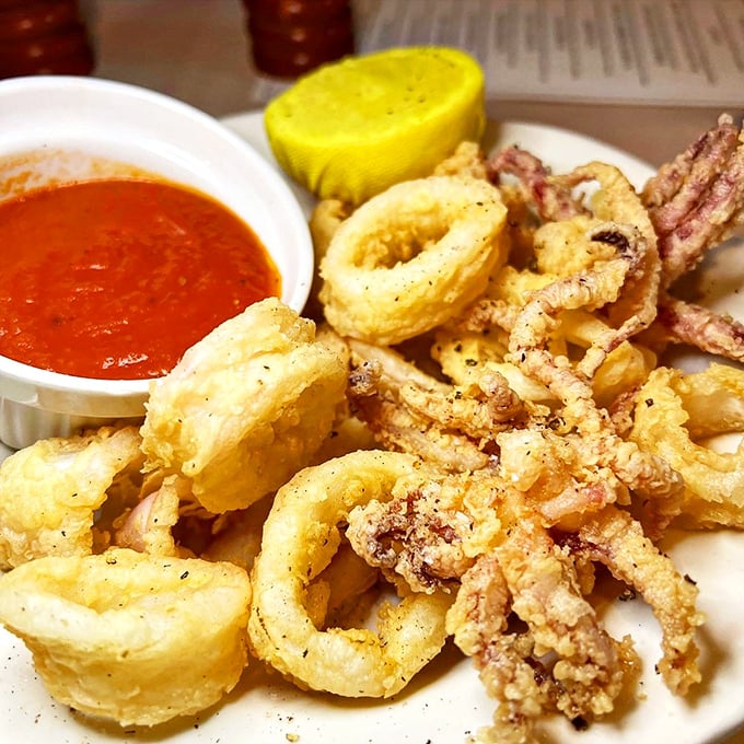 Golden-fried calamari that would make Neptune himself swim to shore. That marinara sauce is the perfect tangy dance partner.