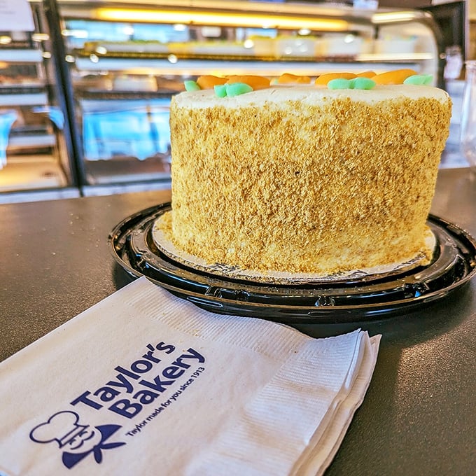 Up close with the star of the show—Taylor's carrot cake sits regally on its throne, those little marzipan carrots practically winking at you.