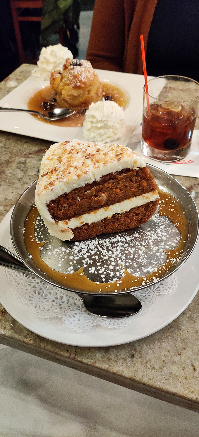 This isn't just dessert, it's architecture &ndash; layers of spice-infused cake foundation supporting the cloud-like cream cheese frosting roof. Perfection exists.