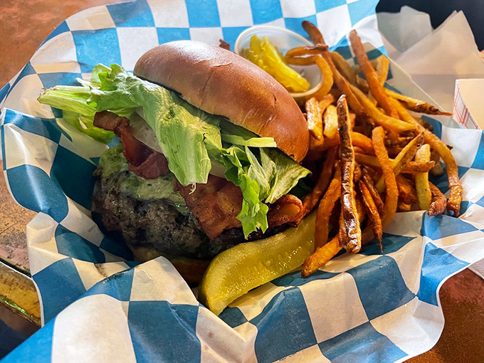The Caw Caw Creek burger doesn't just sit on your plate &ndash; it commands attention with a presence that says "I'm worth every calorie."