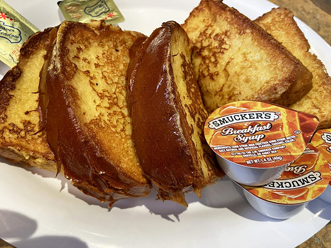 Challah French toast that makes breakfast feel like a warm hug. Golden, crispy exterior giving way to custardy perfection inside.