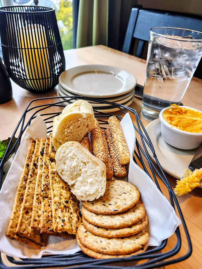 The complimentary bread basket&mdash;civilization's greatest achievement after indoor plumbing. That cheese spread is the secret handshake of serious supper clubs.