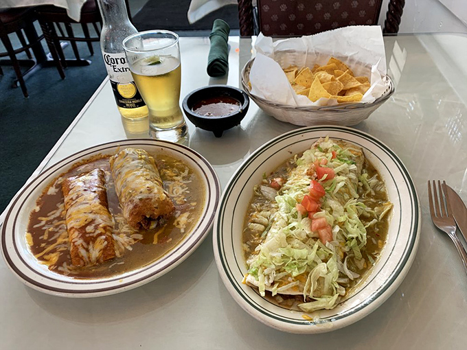 The holy trinity of Mexican comfort: a cheese enchilada, chile relleno, and beef burrito sharing a plate like old friends at a reunion.