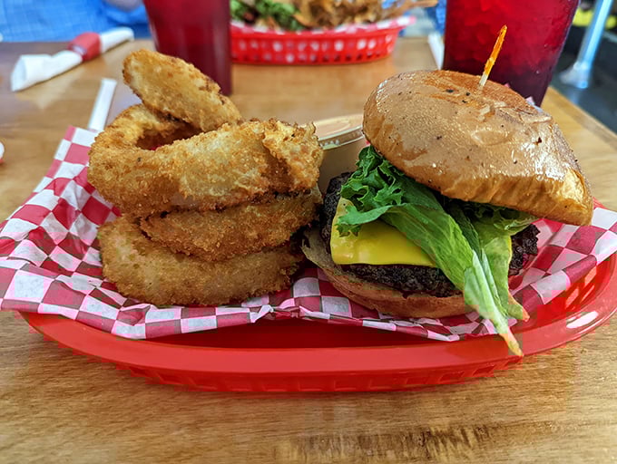 This isn't just a burger&mdash;it's edible architecture. The crispy onion rings serve as delicious golden halos for this sandwich masterpiece.