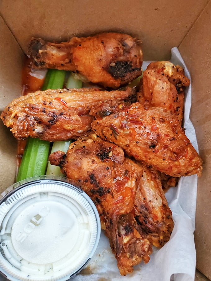 These wings aren't just cooked, they're transformed&mdash;crispy, saucy perfection served with celery sticks that nobody will remember to eat.