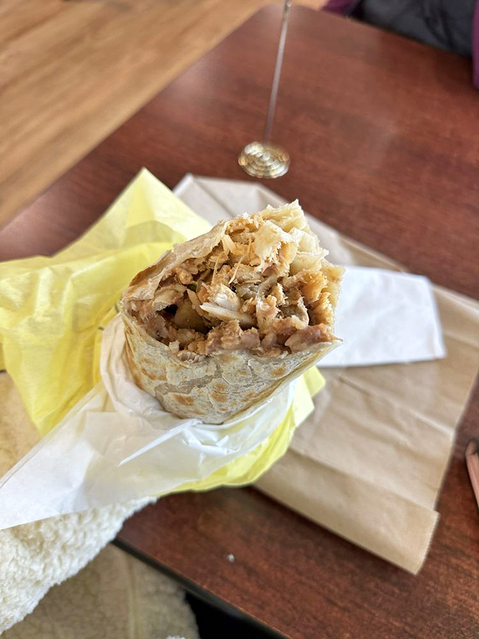 The cross-section reveals the truth &ndash; this chicken burrito isn't messing around. Perfect distribution of ingredients means every bite delivers the full flavor experience.