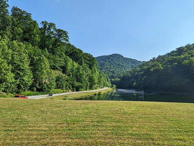 Chief Logan State Park's serene waters reflect mountains that have witnessed centuries of history, offering a tranquil escape just minutes from downtown.