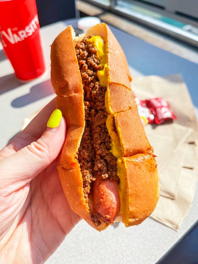 Behold the chili dog in its natural habitat&mdash;a perfect symphony of savory meat, tangy cheese, and soft bun that's worth every napkin.