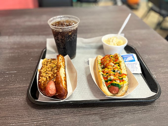 Two Chicago-style dogs showing off their garden of toppings &ndash; proof that sometimes the best salad comes nestled in a poppy seed bun.