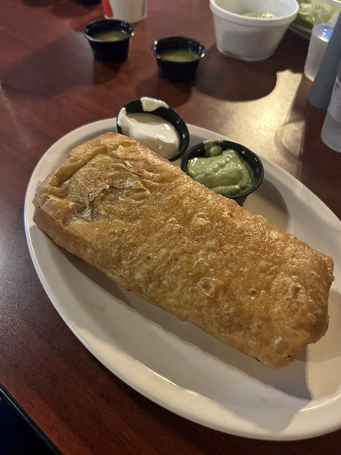 The chimichanga&mdash;where the humble burrito goes to get dressed up. Golden-fried perfection served with sides of guacamole and sour cream for dipping adventures.