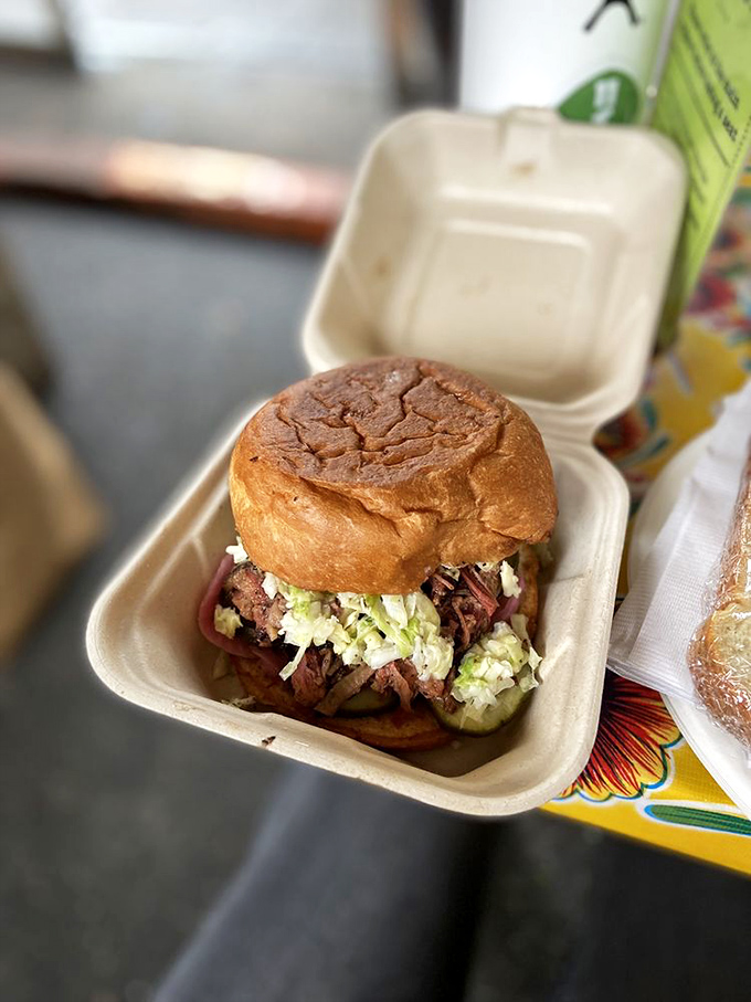 The chopped brisket sandwich&mdash;where buttery soft meat meets pillowy bun. It's the kind of handheld happiness that makes you forget table manners exist.