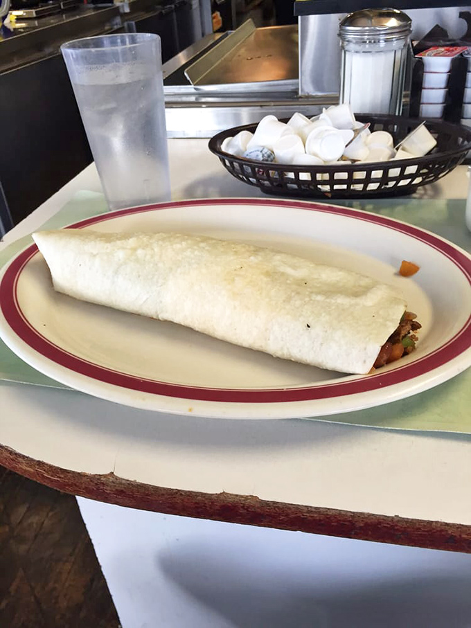 The chorizo breakfast burrito: where spicy sausage meets morning eggs in a relationship so perfect it should have its own reality show.