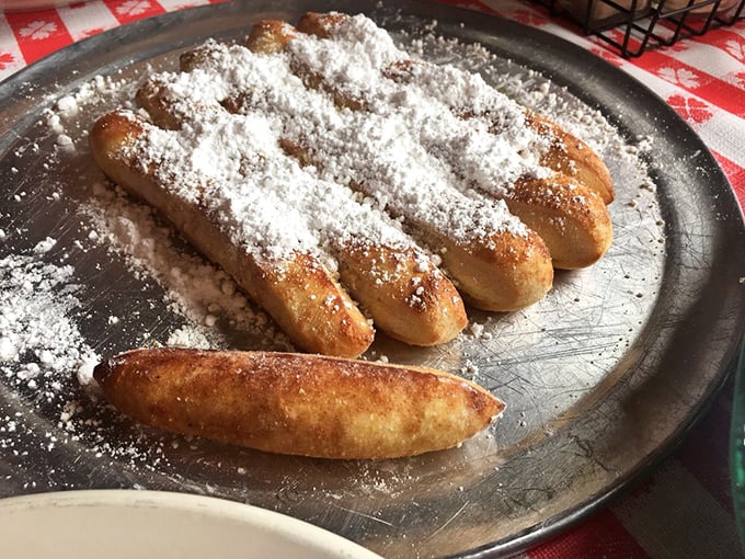 Cinnamon sticks dusted with powdered sugar&mdash;the dessert that makes you wonder why you ever saved room when you could have ordered two.