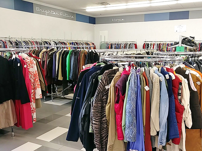 Words of inspiration—"Brighter Future" and "Hope"—watch over racks of clothing waiting for their next chapter in someone else's story.