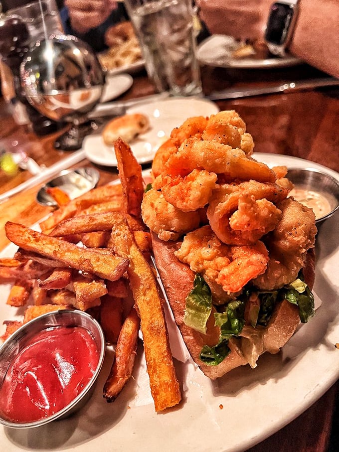 Golden-fried shrimp piled high on a sandwich that requires both hands and several napkins. Diet plans, consider yourselves officially on vacation.