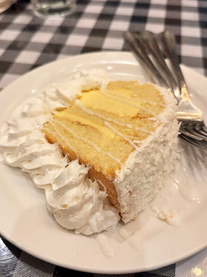 Coconut cake that would make your grandmother both proud and jealous. Those layers of moist yellow cake and fluffy frosting are what dessert dreams are made of.