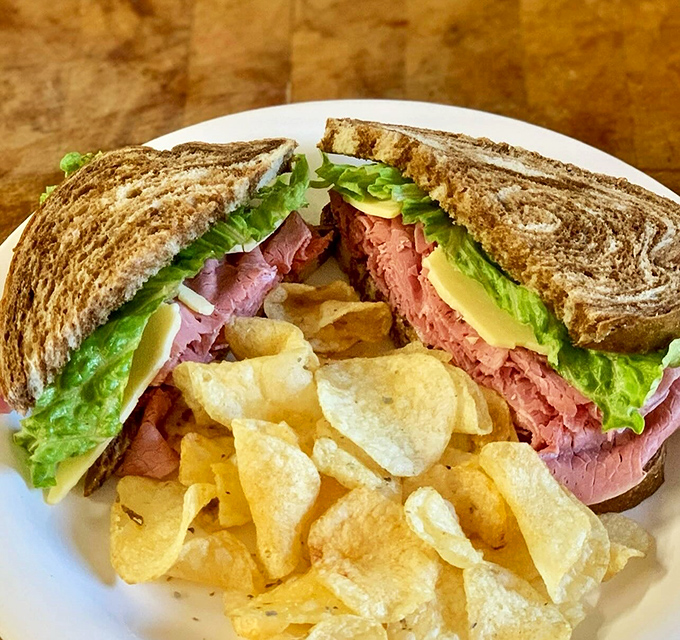 Not your sad office lunch sandwich&mdash;this beauty features thick-cut corned beef, fresh lettuce, and just the right amount of everything else. The potato chips aren't just a garnish.