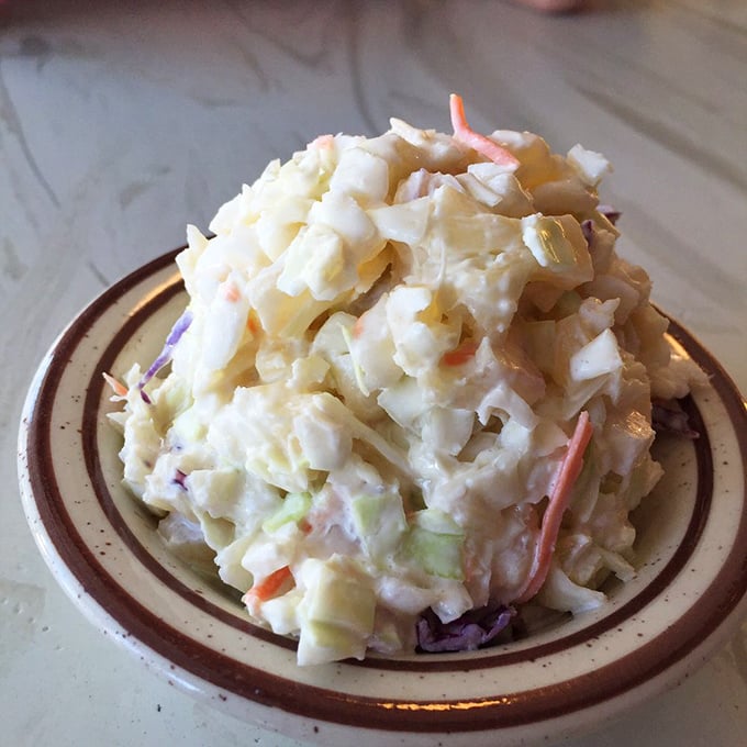 This isn't just coleslaw; it's a creamy, crunchy counterpoint to all that fried goodness&mdash;like the cool jazz ballad after a rock anthem.