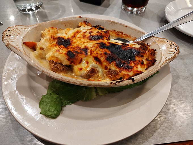 Mushrooms playing dress-up in their finest crab attire. This bubbly, golden appetizer disappears faster than rain in the desert.