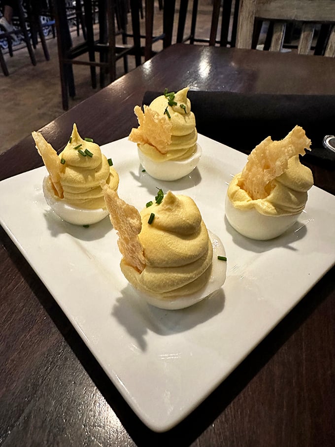 Deviled eggs that make church potluck versions hang their heads in shame. The piping technique alone deserves its own Food Network special.