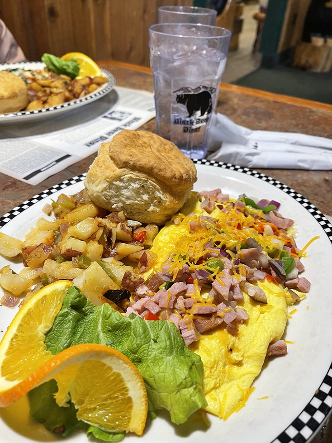Breakfast alchemy at its finest: a Denver omelet that could feed a small hiking party, paired with a biscuit that's practically begging for butter.