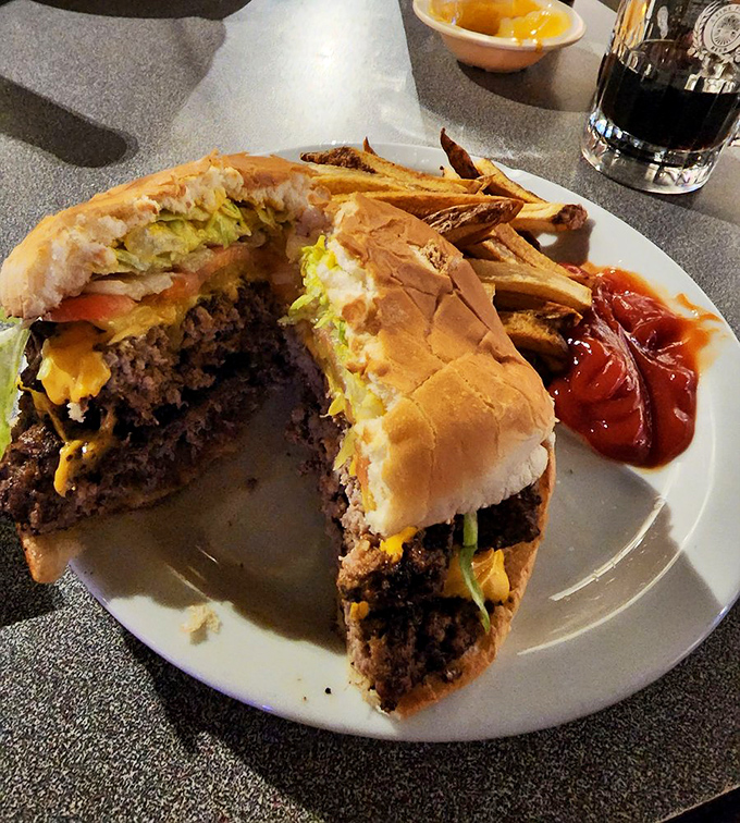 Behold the burger that launched a thousand napkins. That cross-section reveals the truth&mdash;no food stylist needed when your patties are this juicy and your cheese this perfectly melted.