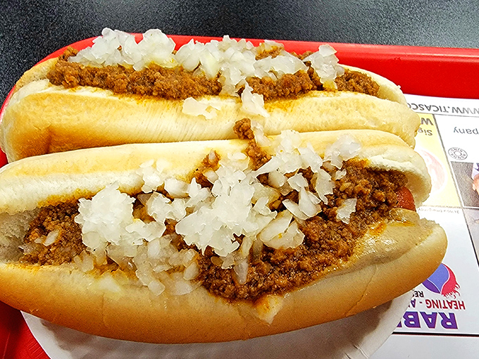 Two's company, especially when it comes to these chili-slathered beauties. The proper order for anyone who knows that one dog is never enough.