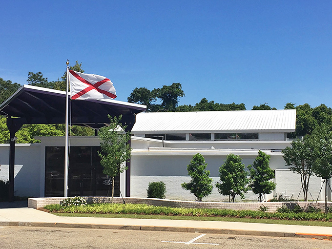 The Eastern Shore Art Center proudly flies Alabama's flag, standing as a cultural cornerstone where creativity blooms year-round.