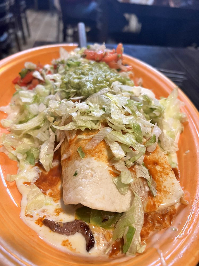 This burrito isn't just wrapped&mdash;it's embraced by fresh lettuce and a blanket of sauce that makes every bite a journey to flavor town.