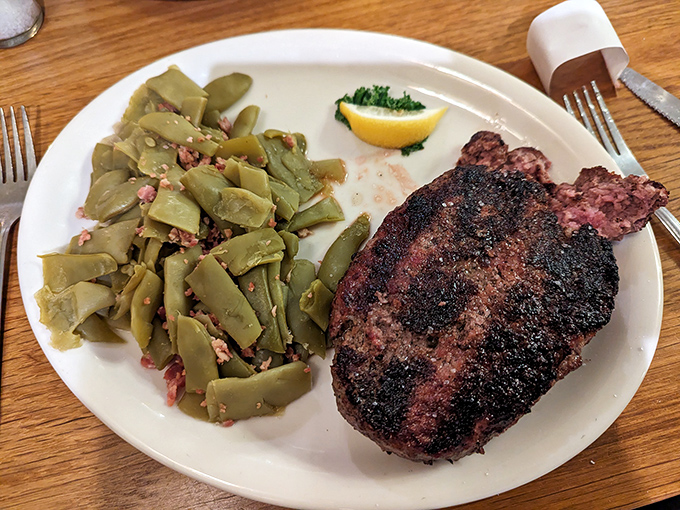 Green beans with bacon bits alongside a steak with that textbook char? This isn't just dinner; it's proof that sometimes the classics become classics for a very good reason.