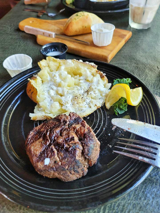 This filet mignon has the kind of perfect sear that makes vegetarians question their life choices. The potato's not bad either.