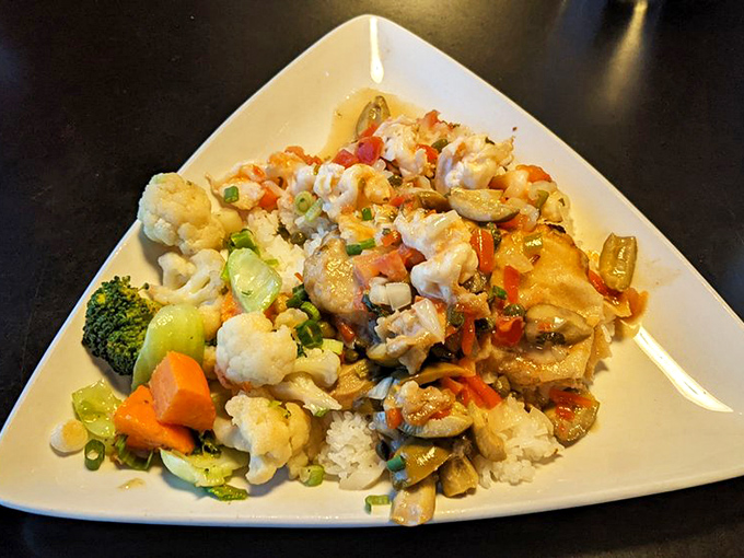 A colorful fiesta on a plate&mdash;vegetables dancing around tender fish. This dish doesn't just feed you; it throws a party for your taste buds.