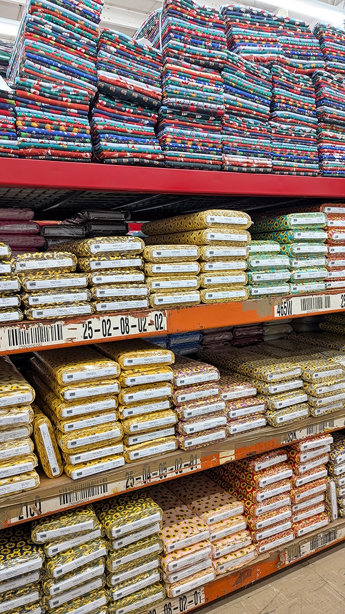 Precut fabric bundles stacked with military precision. The fabric equivalent of those fancy chocolate boxes where you want one of each.