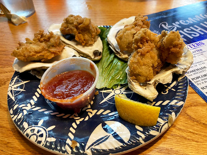Fresh breaded oysters that crunch like autumn leaves but taste like ocean poetry. That red sauce isn't just a condiment&mdash;it's a supporting actor.