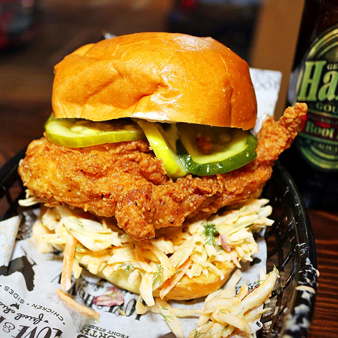 This isn't just a sandwich &ndash; it's architecture. The crispy chicken and pickle skyscraper demands to be admired before demolished.