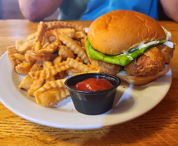 This isn't just a chicken sandwich&mdash;it's a masterclass in texture. Crispy coating, soft bun, fresh toppings, and those fries! Chef's kiss!
