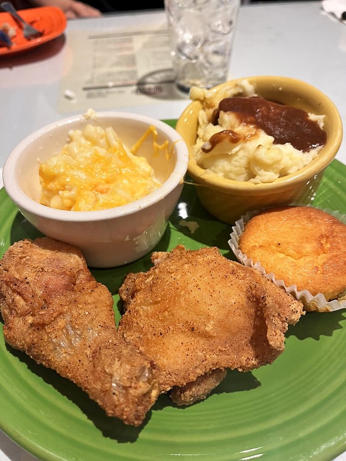 A plate that tells the whole story: fried chicken, mac and cheese, and a corn muffin&mdash;the soul food trinity that nourishes both body and spirit.
