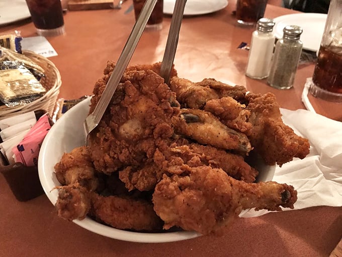 A mountain of perfectly fried chicken that makes you want to cancel all afternoon plans and surrender to the food coma that's coming.