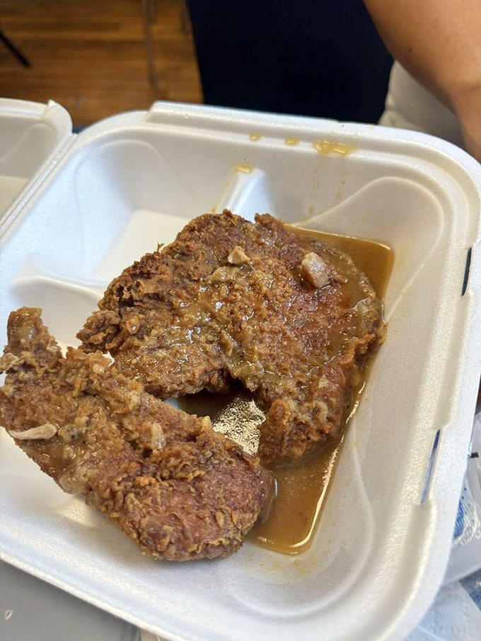 Smothered pork chops swimming in gravy that could make even your most stoic uncle tear up with joy.