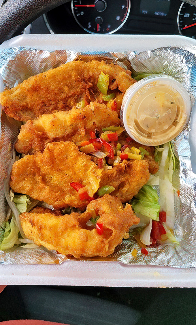 Golden-fried catfish that makes you wonder why anyone bothers with fancy cooking techniques when perfection is this simple.