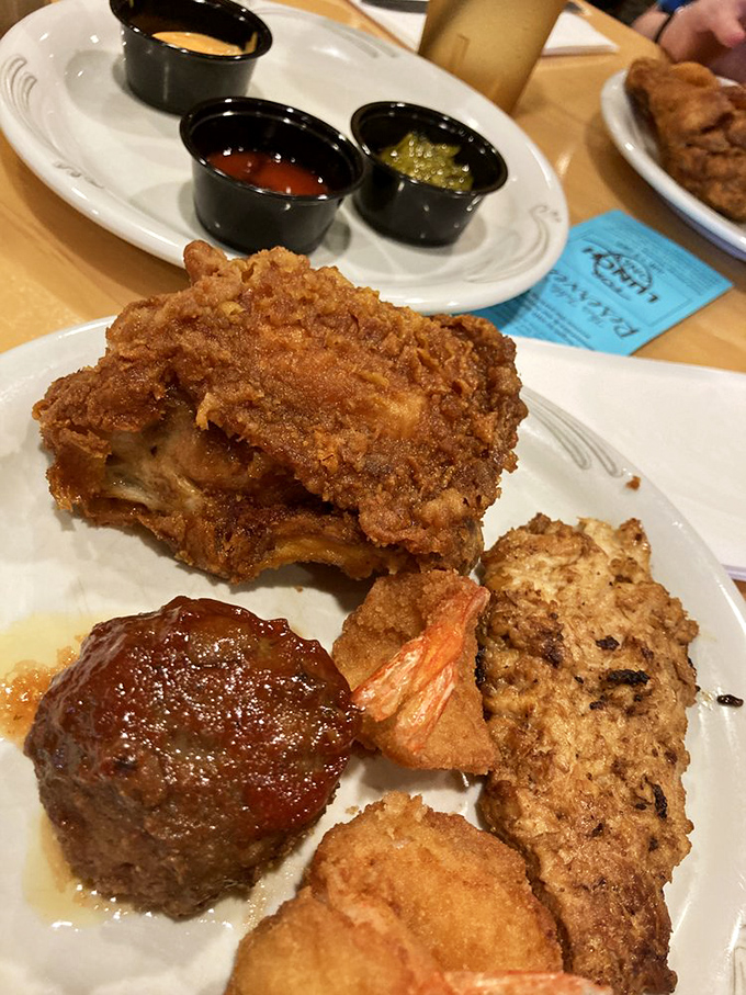 A plate that tells a story of perfect balance&mdash;crispy chicken, savory meatball, and vegetables playing supporting roles in this edible ensemble cast.