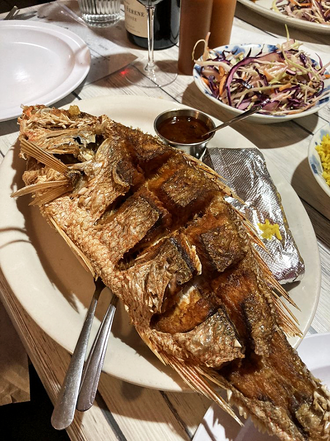 Scored and fried to golden perfection, this fish has the kind of crackling skin that makes potato chips jealous.