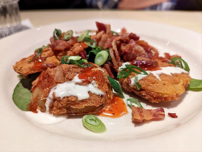 Fried green tomatoes: the South's gift to civilization. Crispy, tangy discs topped with creamy sauce and bacon&mdash;vegetables that make you forget they're good for you.