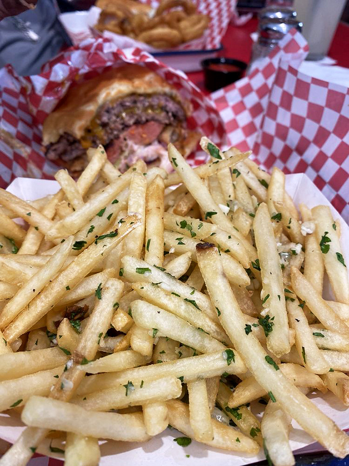 These aren't just fries; they're golden happiness sticks dusted with herbs. The kind that make you forget your "just one more" promises.