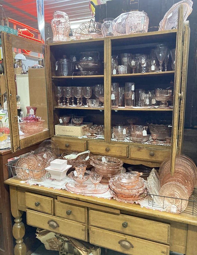 Pink Depression glass sparkles under the lights, each delicate piece surviving the decades when so many others shattered. Grandmother would approve of this collection.