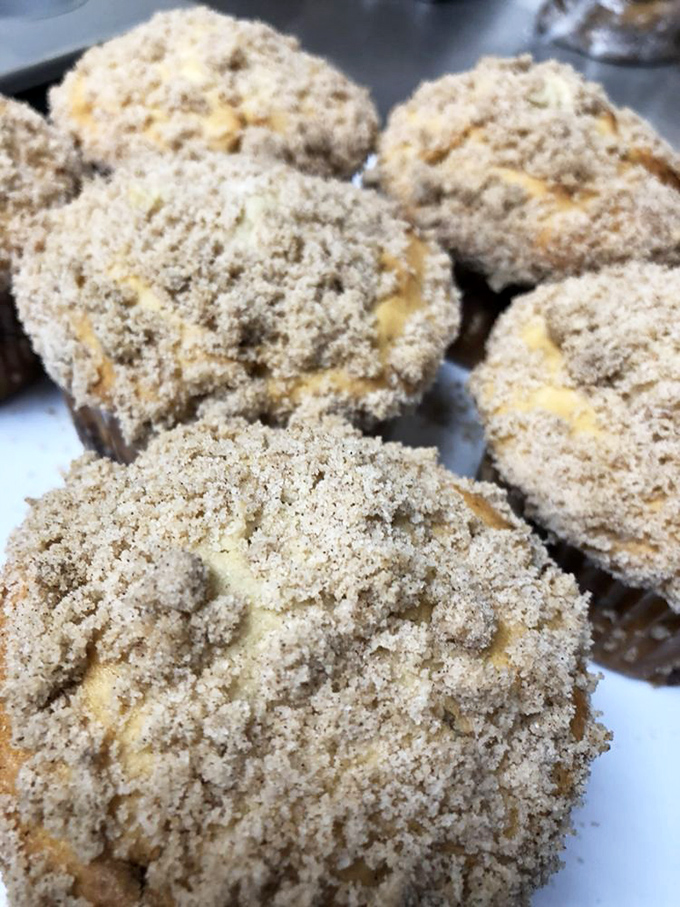 These cinnamon streusel muffins look like they're wearing tiny sweaters knitted from sugar and spice &ndash; cozy comfort in every crumbly bite.