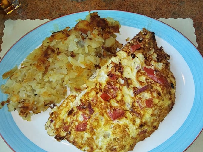 The Greek omelet arrives like a mythology lesson on a plate—the gods would surely approve of this feta-filled masterpiece alongside those gloriously crispy home fries.