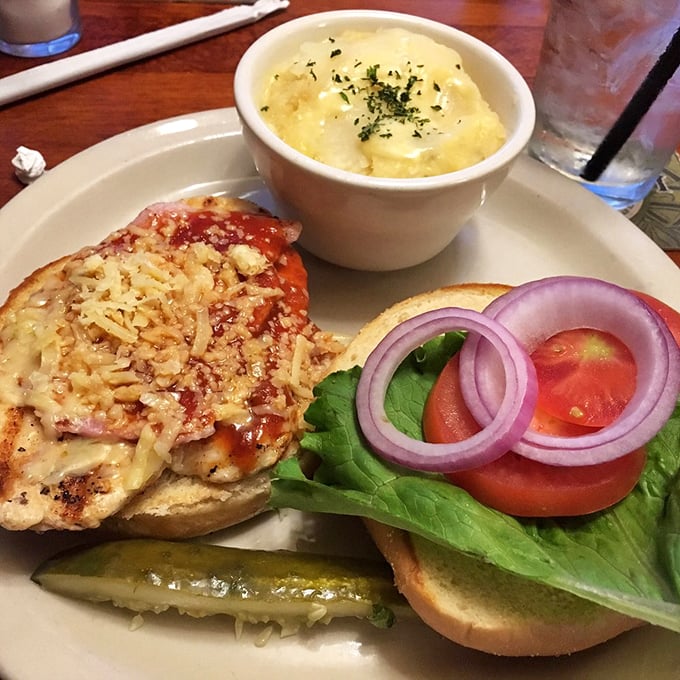 This chicken sandwich isn't just dressed – it's ready for the red carpet. Melted cheese, fresh veggies, and a bun that's somehow both sturdy and tender.