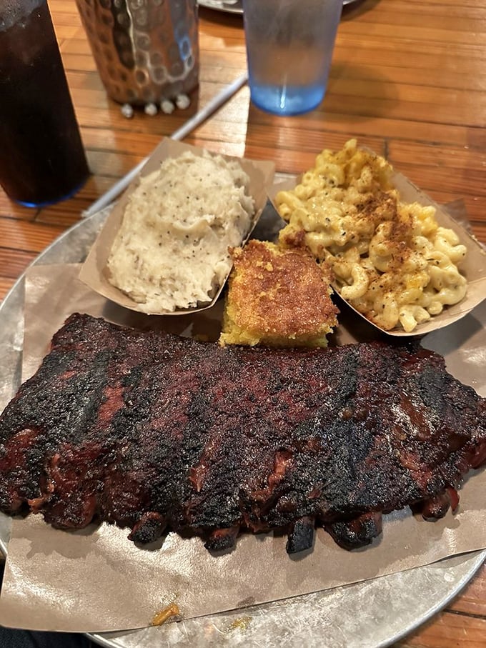 Behold the bark! These ribs wear their smoke-infused crust like a medal of honor, flanked by sides that know their supporting role.