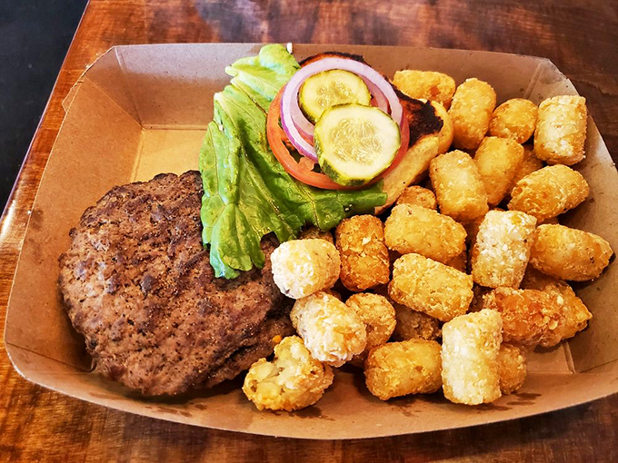 Simplicity perfected: a classic burger with crispy golden tots. Sometimes the straightforward approach is the path to true enlightenment.